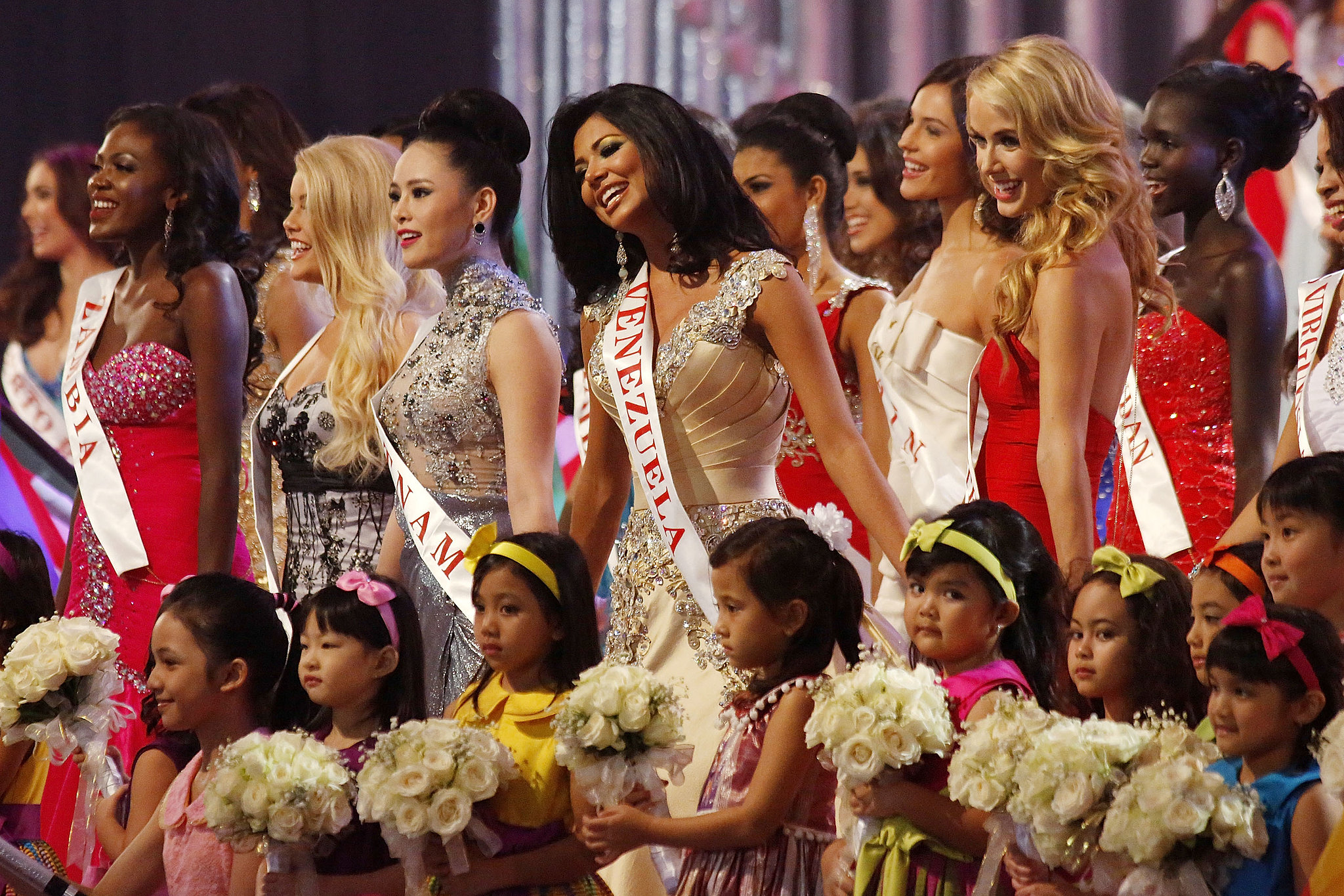 The Miss World contestants sang with a group of children during the ...